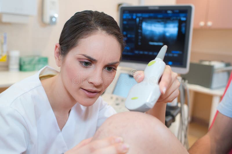 Doctor Performing Ultrasound Stock Photo - Image of sonogram, study ...