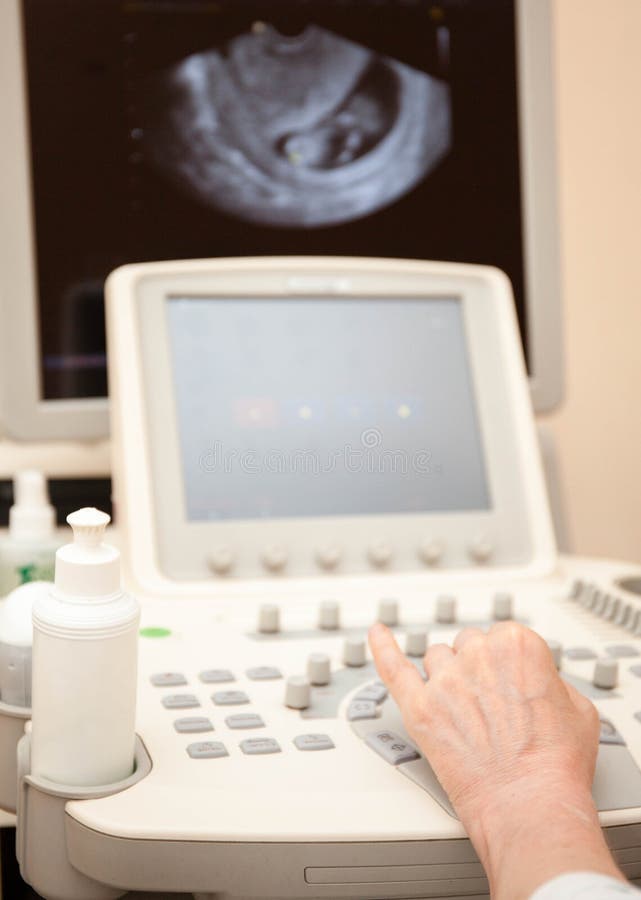 Doctor Performing an Ultrasound Examination Stock Photo - Image of ...
