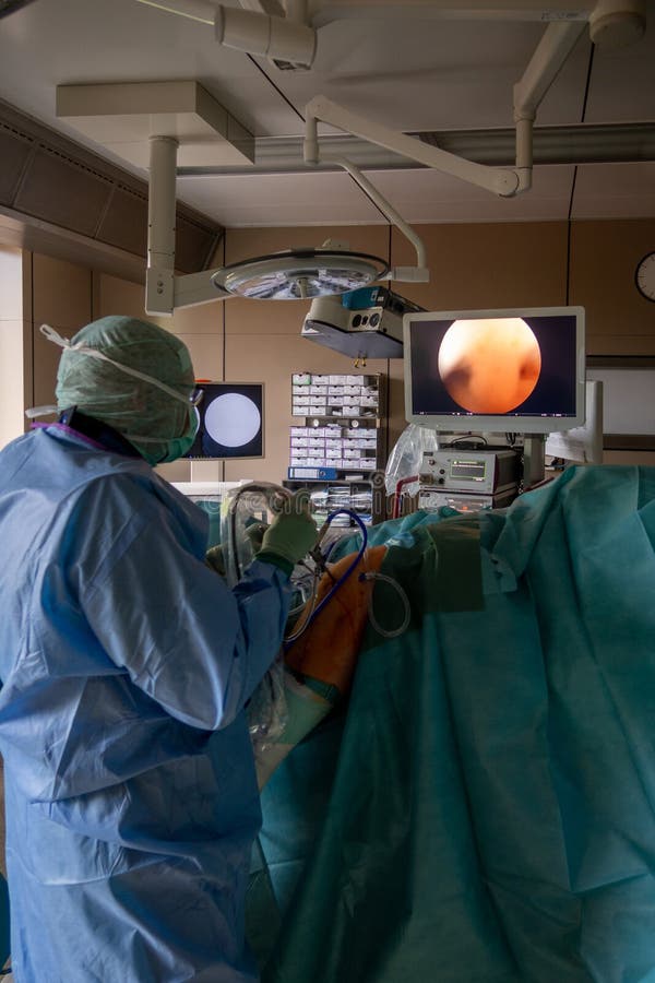 A Doctor Performs a Surgical Knee Endoscopy in an Operating Room Stock ...