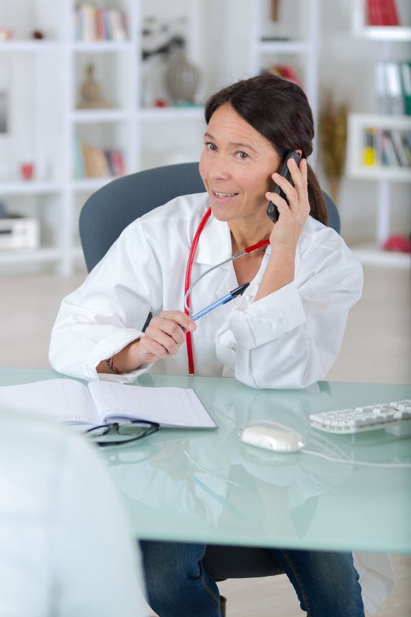 Doctor on Phone Calling Analyzes Centre with Patient Stock Image ...