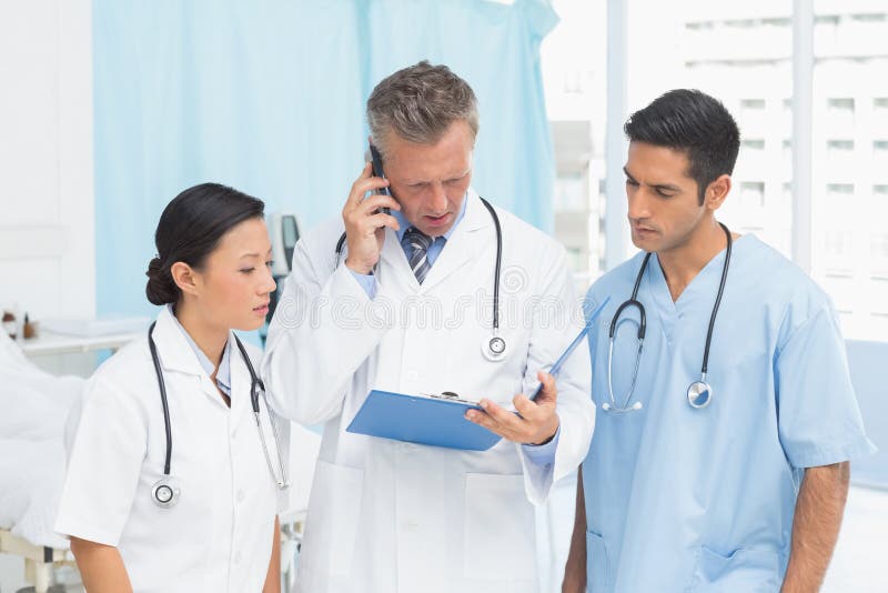 Doctor on Phone Discussing Patient S Spinal Scans Stock Photo - Image ...