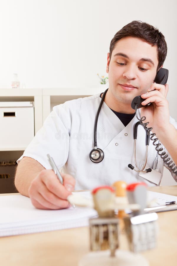 Doctor on the phone stock image. Image of medicine, phone - 12941251