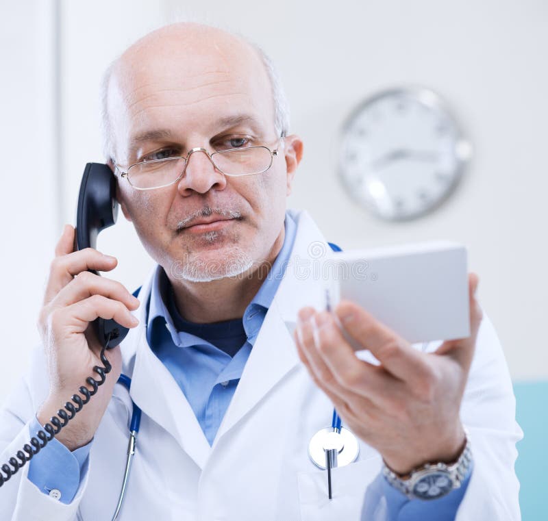 Doctor on the phone stock photo. Image of handset, healthcare - 44562620