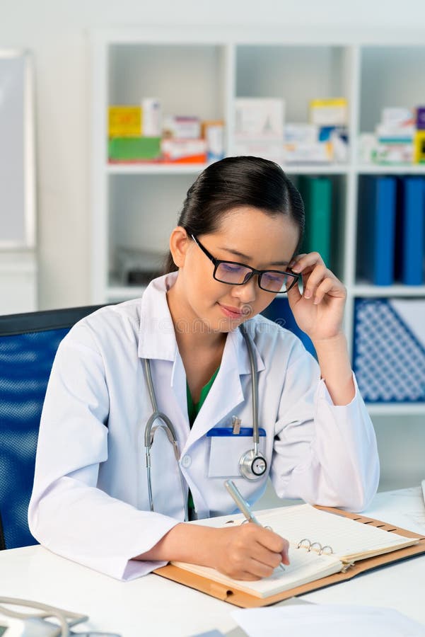 Doctor planning her day stock image. Image of medical - 116338145
