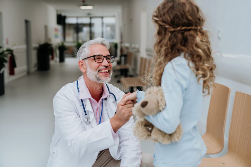 Doctor Playing with His Little Patient at Pediatrics. Stock Image ...