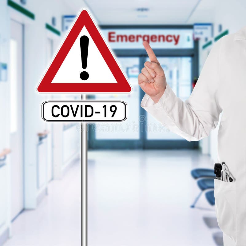 Doctor Points with His Finger at a Warning Covid-19 Sign Stock Image ...