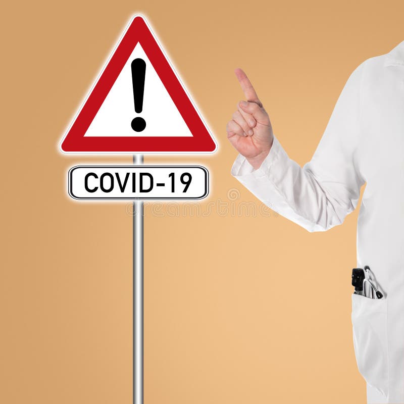 Doctor Points with His Finger at a Warning Covid-19 Sign Stock Photo ...