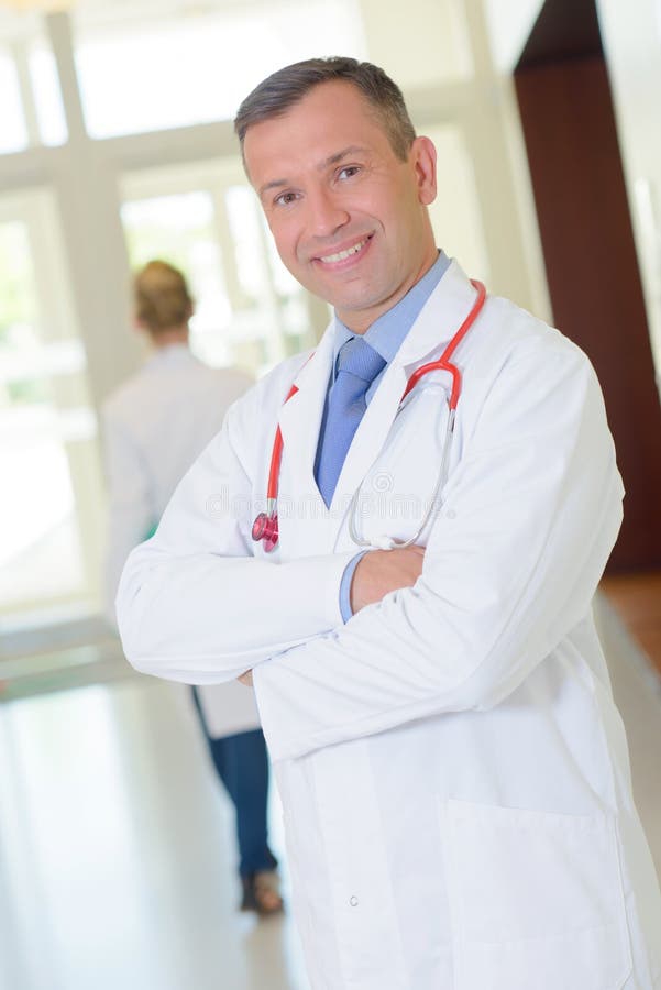 Doctor posing in lobby stock image. Image of patient - 86208053