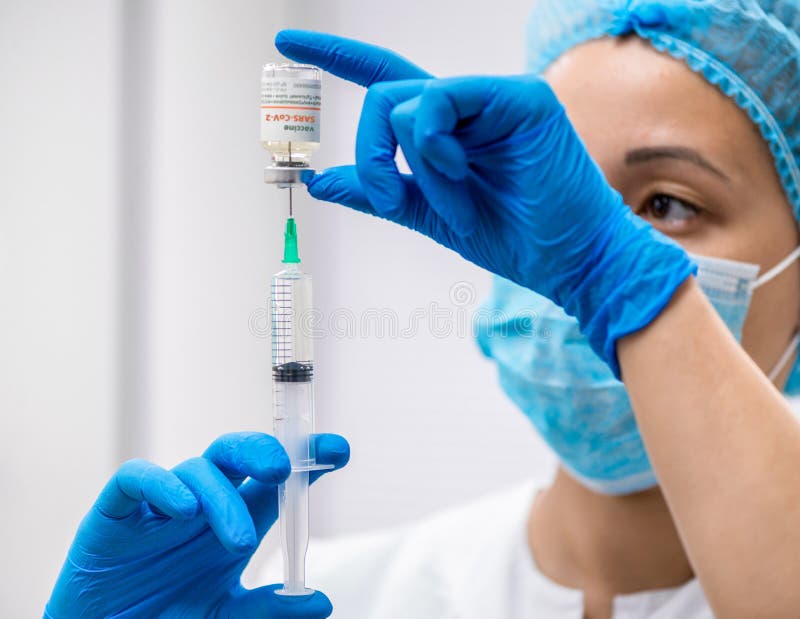 Doctor prepares a syringe stock image. Image of healthcare - 264205051