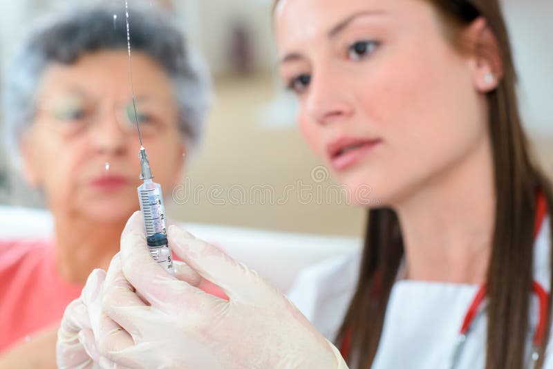 Doctor Preparing an Injection Stock Photo - Image of injection, female ...
