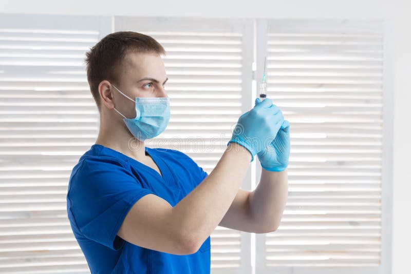 The Doctor is Preparing To Give the Patient an Injection Stock Image ...