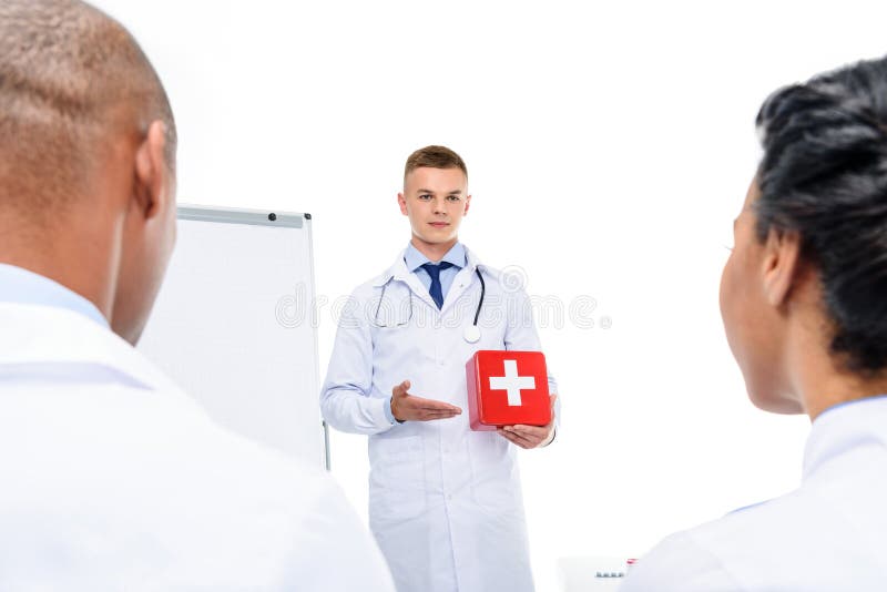 Doctor Presenting First Aid Kit Stock Image - Image of multiethnic ...