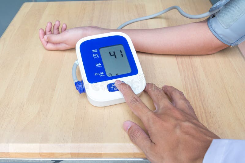 Doctor Press Start Button on Blood Pressure Isolated on White Ba Stock ...