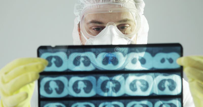 Doctor in Protective Clothes Learning Brain CT Scan X-ray Image on ...