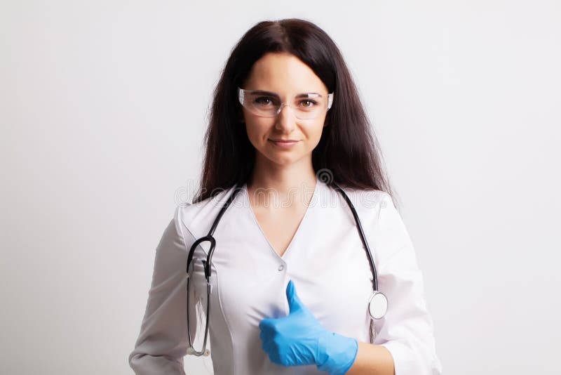 Doctor with Protective Goggles and Stethoscope on Her Workspace Stock ...