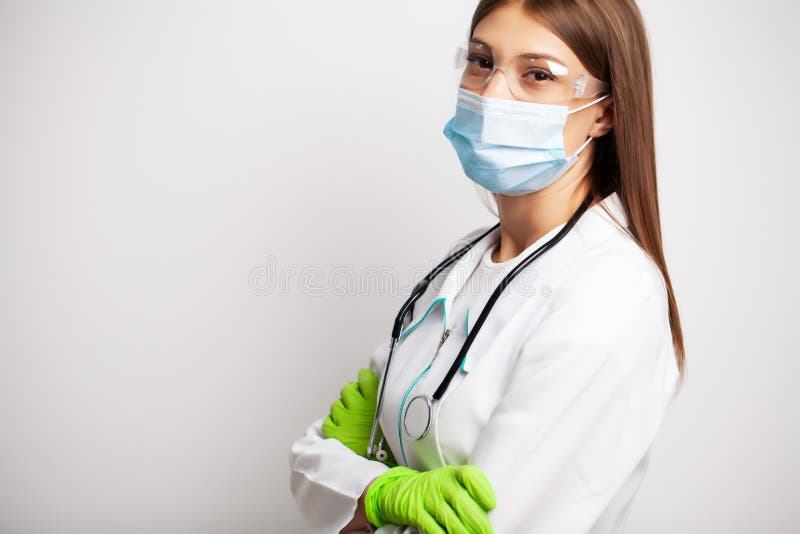 Doctor with Protective Goggles and Stethoscope on Her Workspace Stock ...
