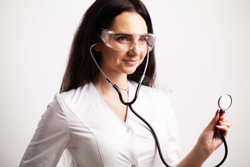 Doctor with Protective Goggles and Stethoscope on Her Workspace Stock ...