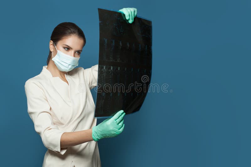 Doctor in Protective Medical Mask Holding Computed Tomography Scan on ...
