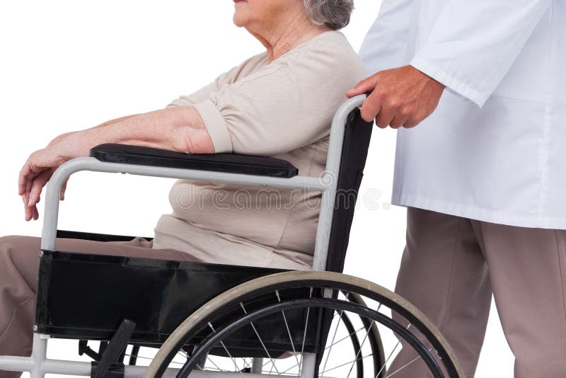 Doctor Pushing Patient in Wheelchair Stock Image - Image of care, shot ...