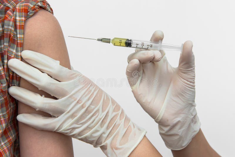 Doctor needle injection stock image. Image of injection - 5791139