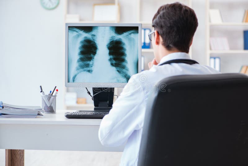 The Doctor Radiologist Looking at X-ray Images Stock Image - Image of ...