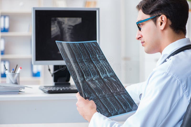 The Doctor Radiologist Looking at X-ray Images Stock Image - Image of ...