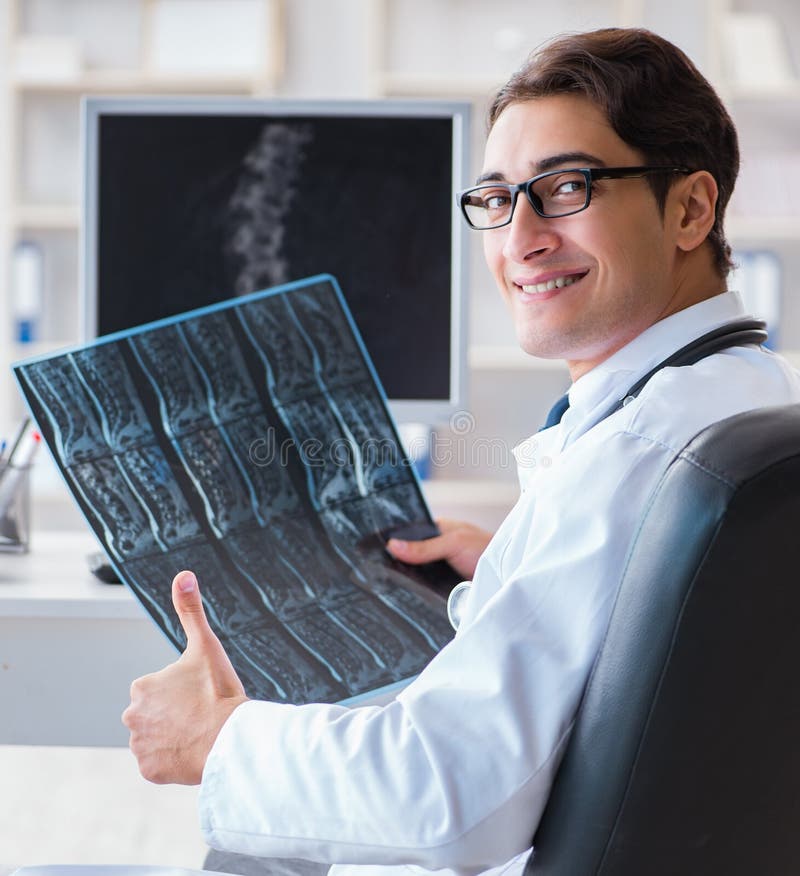 Doctor Radiologist Looking at X-ray Images Stock Image - Image of ...
