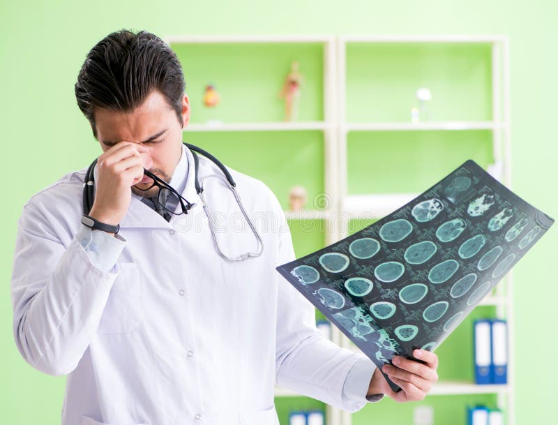 Doctor Radiologist Looking at X-ray Scan in Hospital Stock Image ...