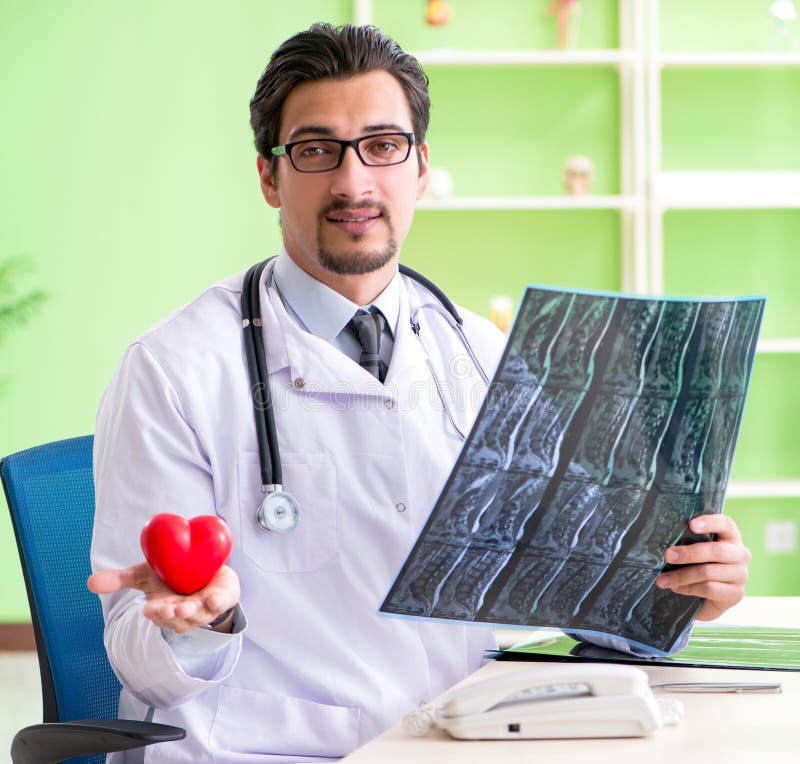 Doctor Radiologist Looking at X-ray Scan in Hospital Stock Photo ...