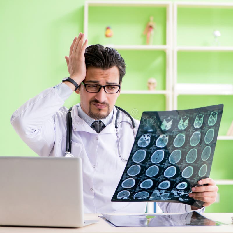 Doctor Radiologist Looking at X-ray Scan in Hospital Stock Image ...