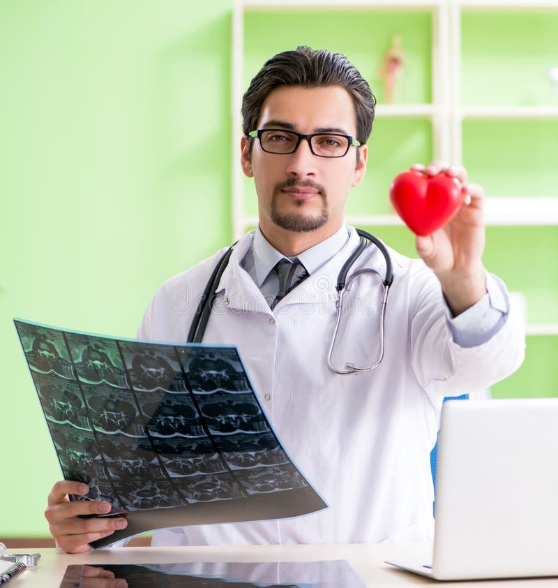 Doctor Radiologist Looking at X-ray Scan in Hospital Stock Photo ...