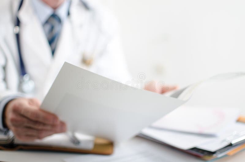Doctor Reading Medical Notes Stock Image - Image of healthcare ...