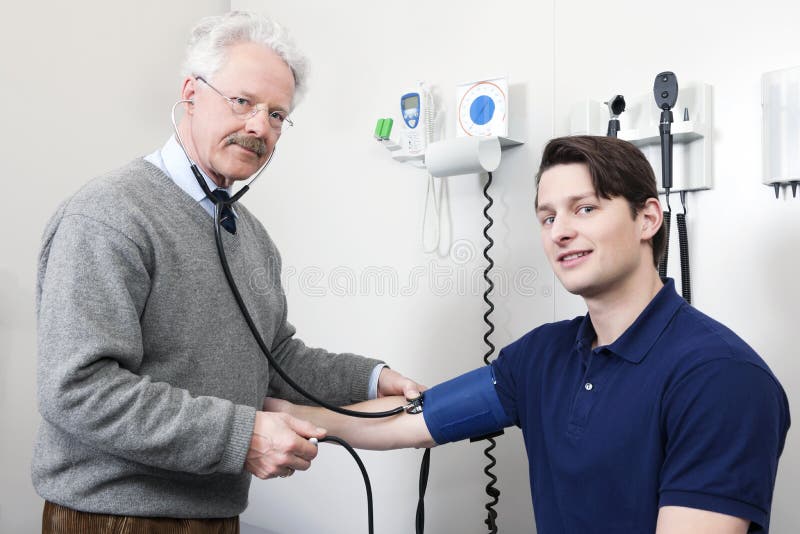 Doctor Reading Pulse Rate of a Patient Stock Photo - Image of checkup ...