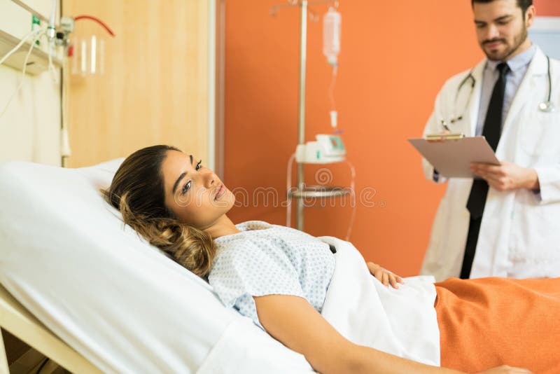 Doctor Reading Reports To Sad Patient at Hospital Stock Photo - Image ...