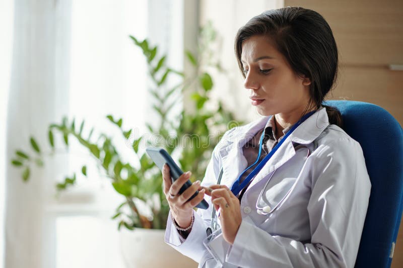 Doctor Checking Text Messages Stock Image - Image of news, answer ...