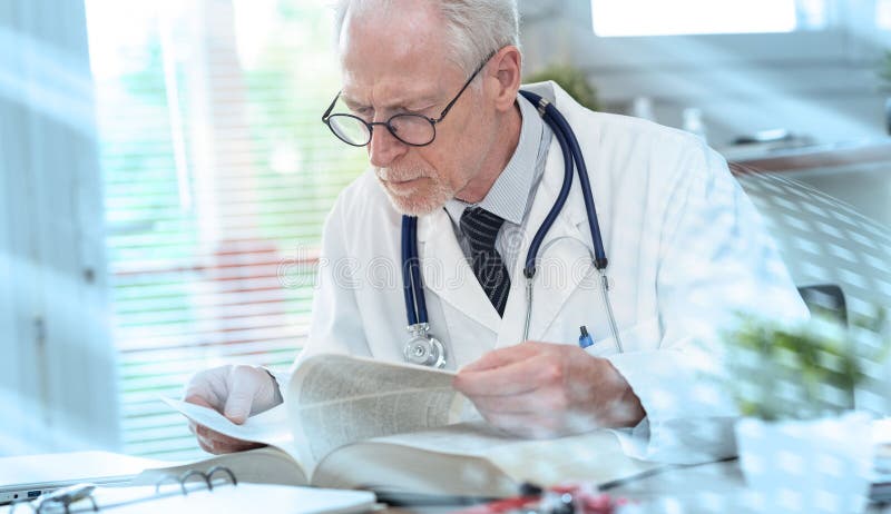 Doctor Reading a Textbook Light Effect Stock Image - Image of sitting ...