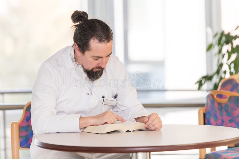 Doctor Reads a Book during Lunch Break Stock Image - Image of doctor ...