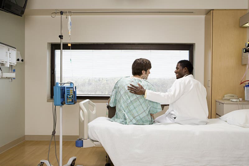 Doctor reassuring patient stock image. Image of medical - 62561029