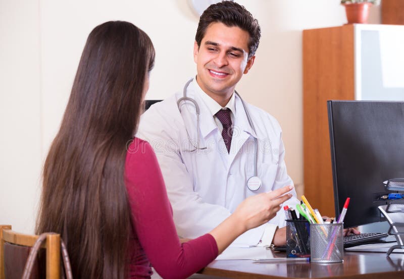 Doctor Receiving And Questioning Teen Patient At Office Stock Image ...