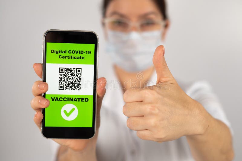 The Doctor Recommends Vaccination and Holds a Smartphone with a QR Code ...