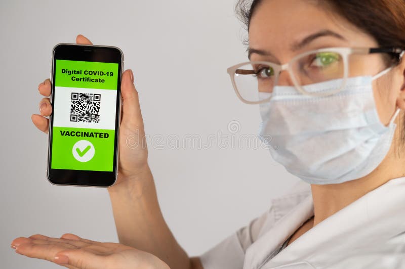 The Doctor Recommends Vaccination and Holds a Smartphone with a QR Code ...