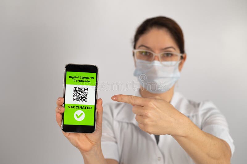 The Doctor Recommends Vaccination and Holds a Smartphone with a QR Code ...
