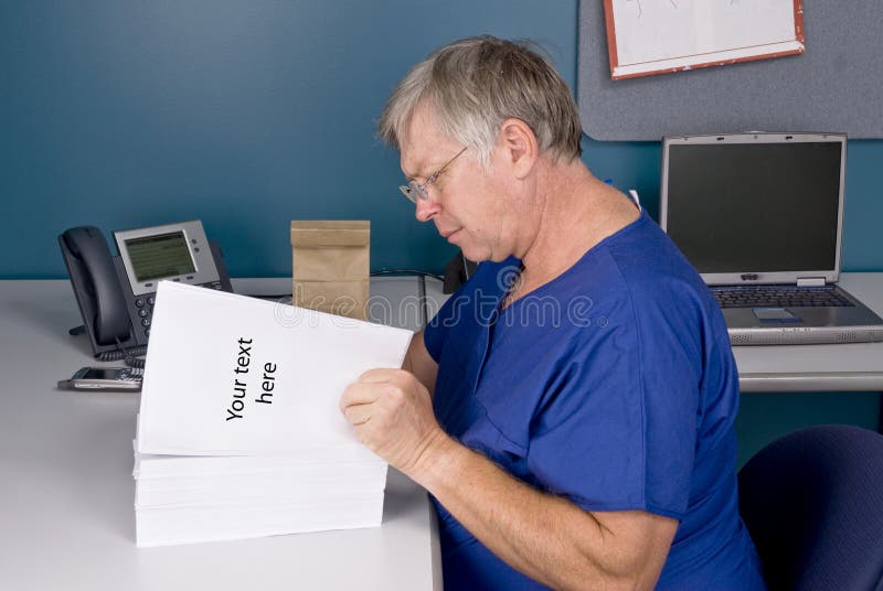 Doctor reviewing document stock image. Image of occupation - 10679375