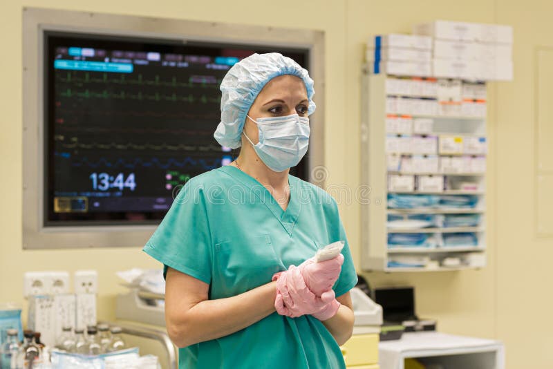 The Doctor`s Assistant Helps the Surgeon during the Operation Stock ...