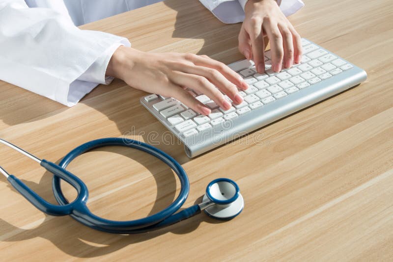 Doctor S Hand at Computer Typing Stock Photo - Image of desk, medical ...