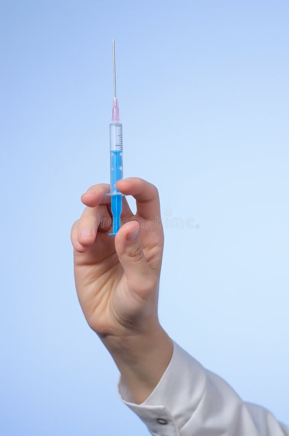 Doctor s hand with syringe stock image. Image of drug - 58743235