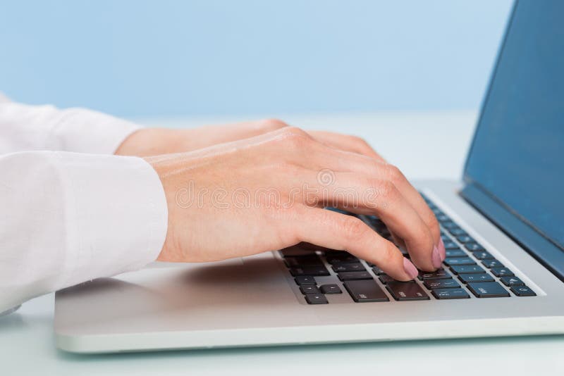 Doctor`s Hand is Typing the Data into the System. Using a Laptop ...