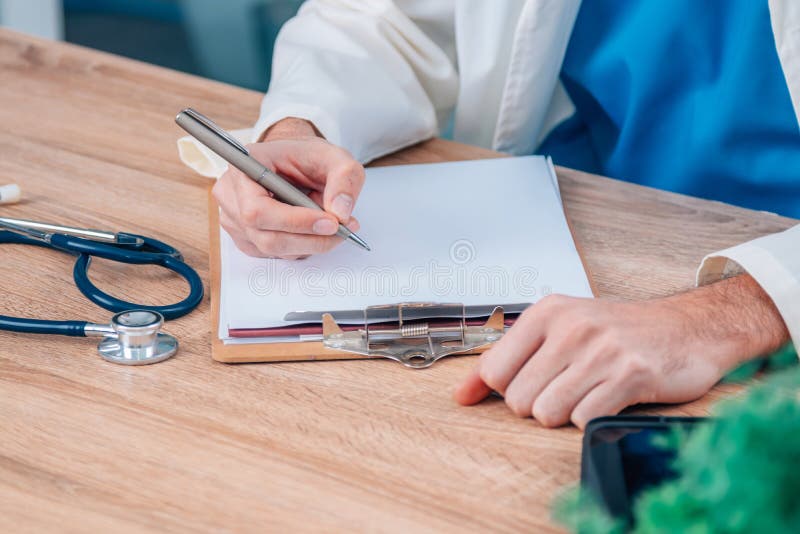 Doctor Hand Writing on Document Stock Image - Image of company, hand ...