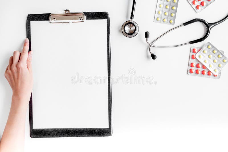 Doctor`s Work Desk in Hospital with Notepad and Stethoscope White ...