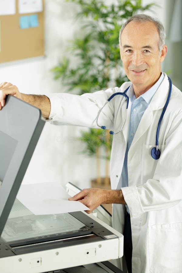 Doctor Scanning on Office Printer Stock Photo - Image of doctor ...